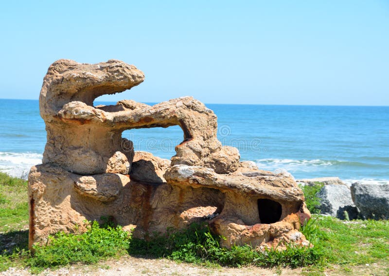 Rock formation on beach stock image. Image of grassy - 55335015