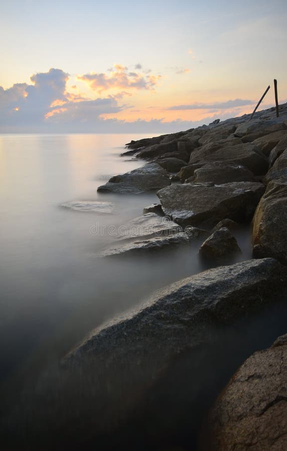 Rock Formation at the Beach during Sunrise on Long Exposure Stock Image ...