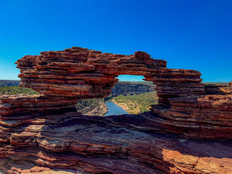 Rock Formation with a Hole in the Middle of it Stock Photo - Image of ...