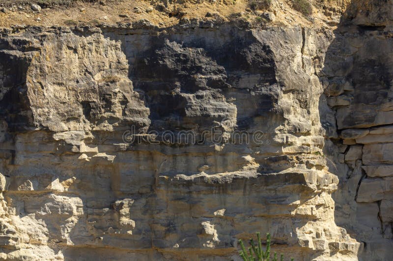 Rock Formations Display Various Geological Layers in a Rugged Landscape ...