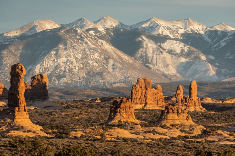 Rock Formations with Distant Snow-covered Mountains in the Distance ...