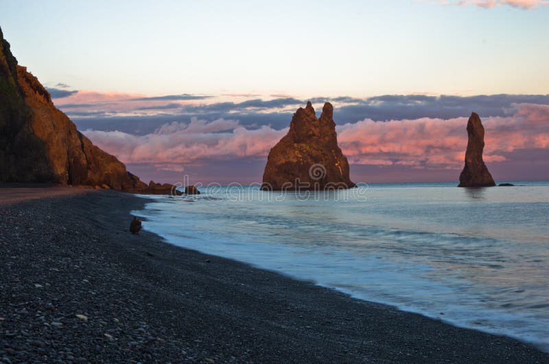 Rock Formations and Dramatic Clouds on Black Beach at Sunset Stock ...