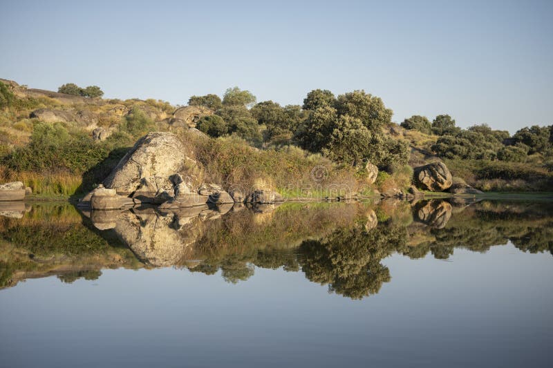 Rock Formations: Large, Rounded Boulders are Scattered Around the Water ...