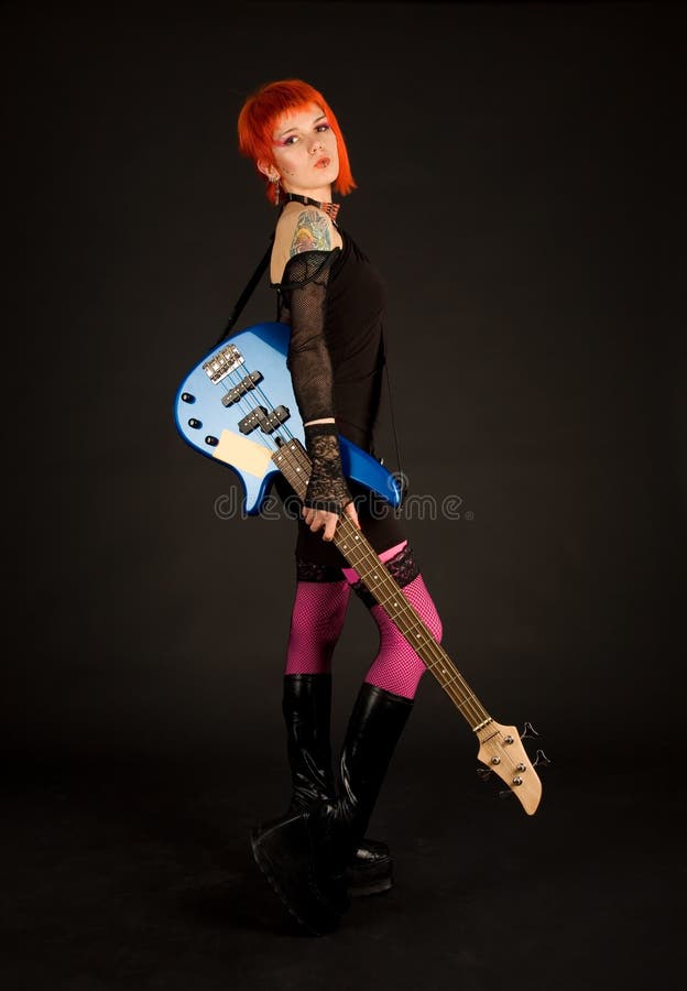 Rock girl with bass guitar stock photo. Image of boots - 9157056