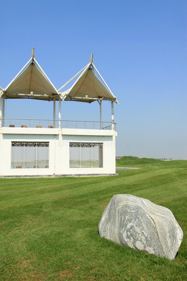 Rock on the golf course stock photo. Image of features - 24574204