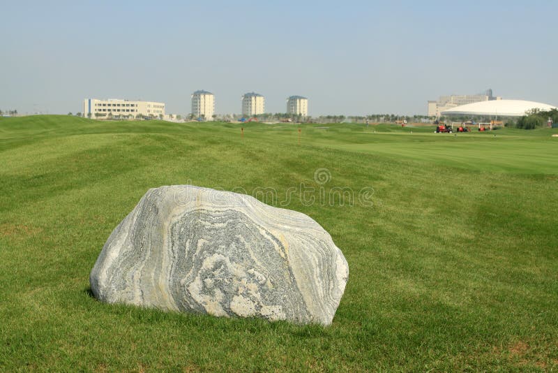 Rock on the golf course stock photo. Image of material - 28426780
