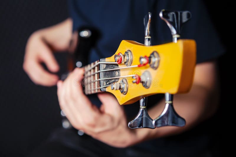 Rock Guitarist Practicing with Bass Guitar. Stock Image - Image of ...