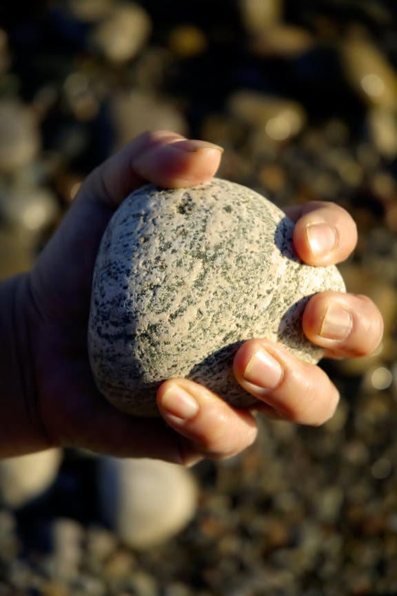 Rock in Hand Closed stock photo. Image of hands, rock, shore - 97070