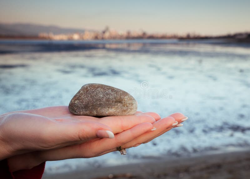 Rock in Hand Closed stock photo. Image of hands, rock, shore - 97070