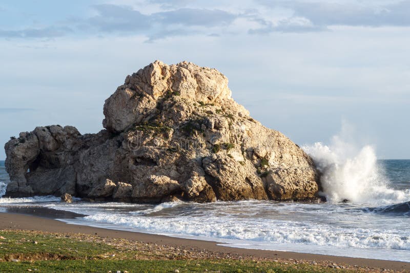 Rock hit by the sea stock image. Image of beach, purple - 50791623