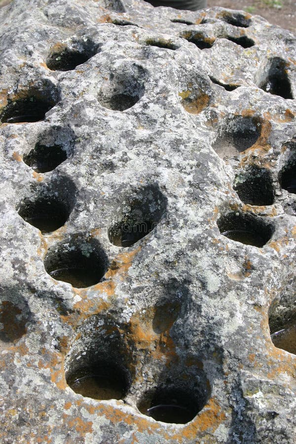 Rock with holes and water stock photo. Image of water - 9121006