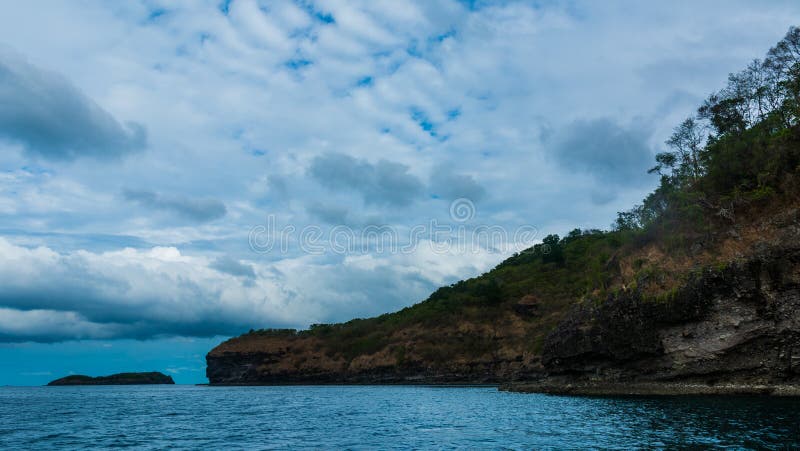Rock Island Over Scenic Blue Sea Water Stock Photo - Image of cape ...