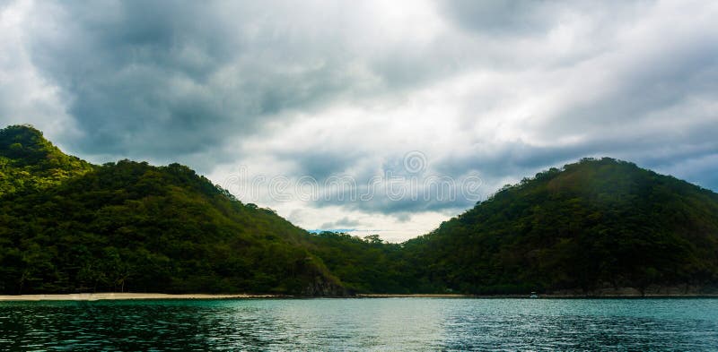 Rock Island Over Scenic Blue Sea Water Stock Image - Image of lake ...