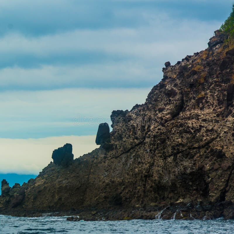 Rock Island Over Scenic Blue Sea Water Stock Photo - Image of terrain ...