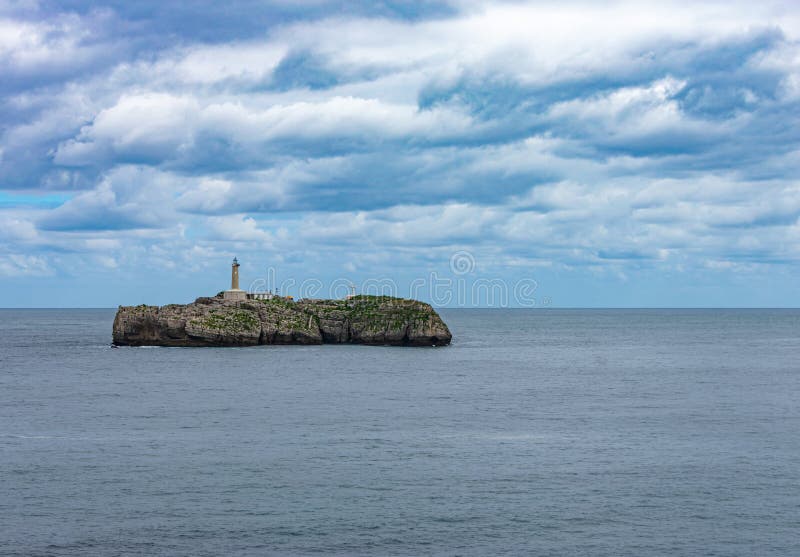 Rock Islet in the Sea with a Lighthouse Stock Image - Image of peaceful ...