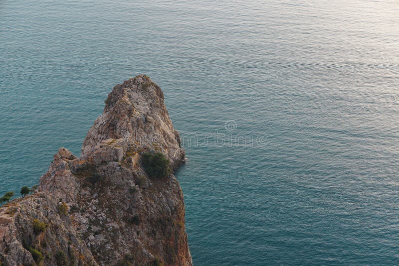 Rock Jutting Out into the Sea Stock Image - Image of rugged, shoreline ...