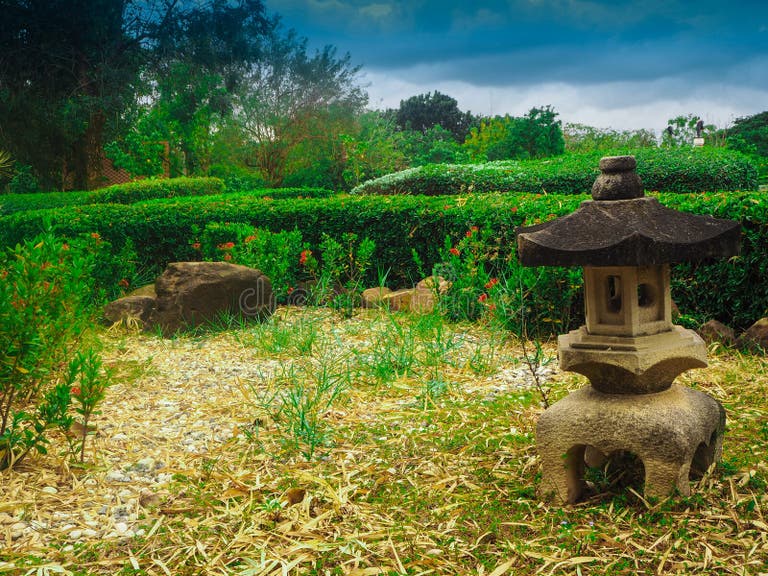 Rock lamp in garden stock photo. Image of plant, green - 85122010