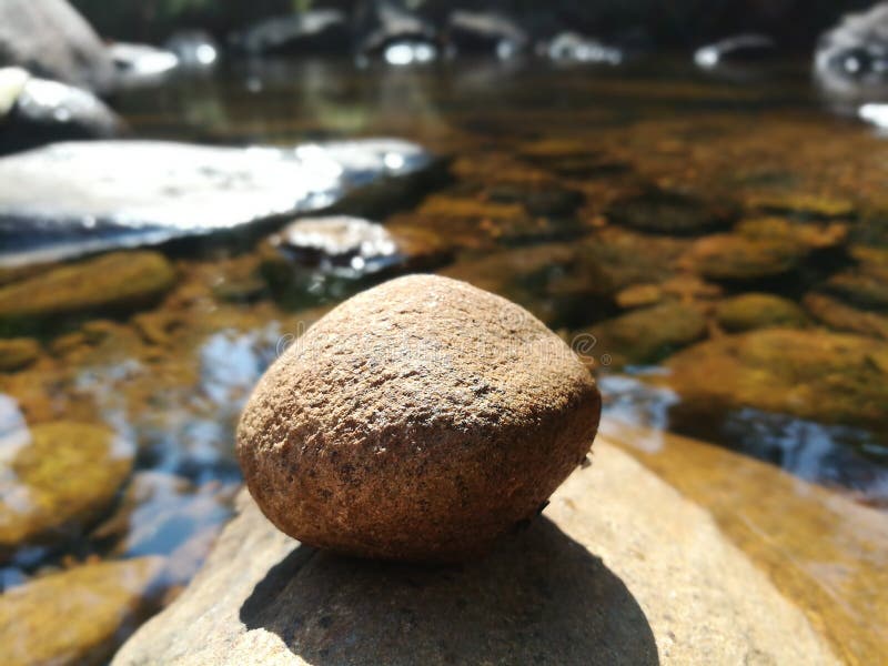 Rock in lonely stock image. Image of water, still, rock - 120414437
