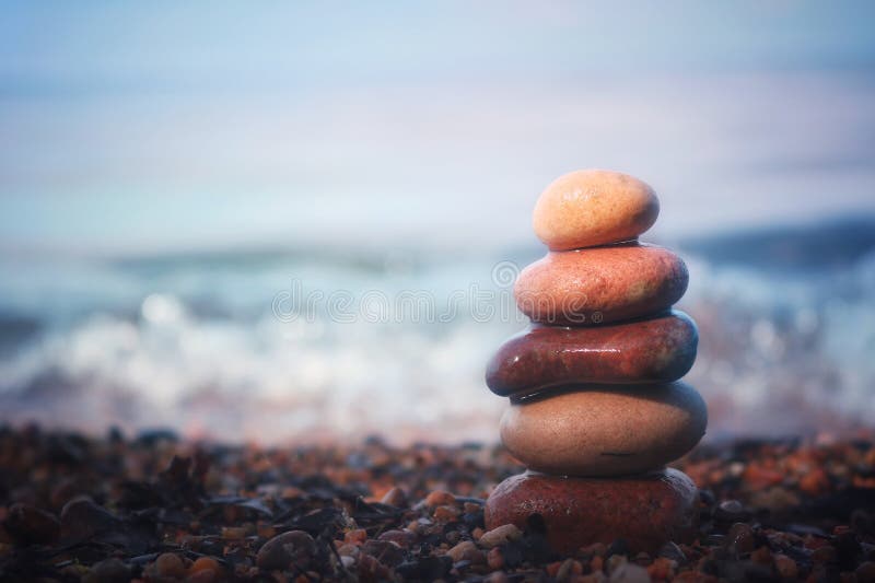 Rock Man on the Beach Under a Faded Pink Sunset Stock Image - Image of ...
