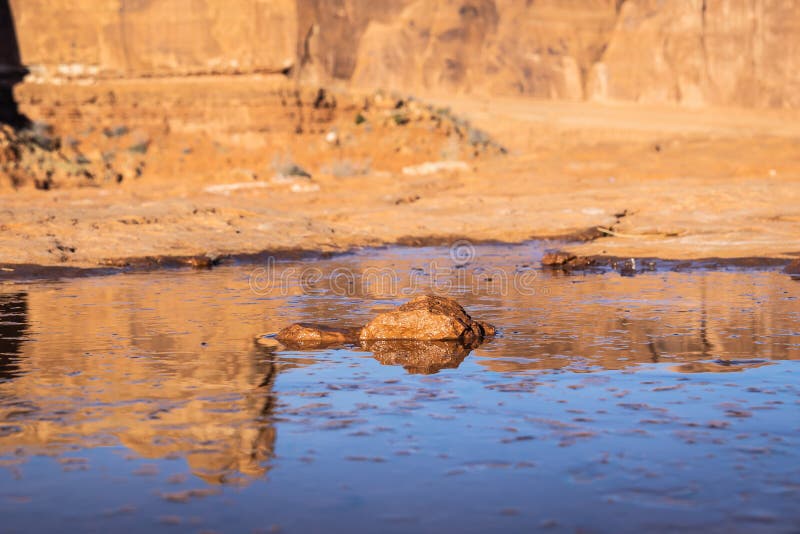 A Rock in the Middle of a Small Frozen Puddle of Water Stock Image ...