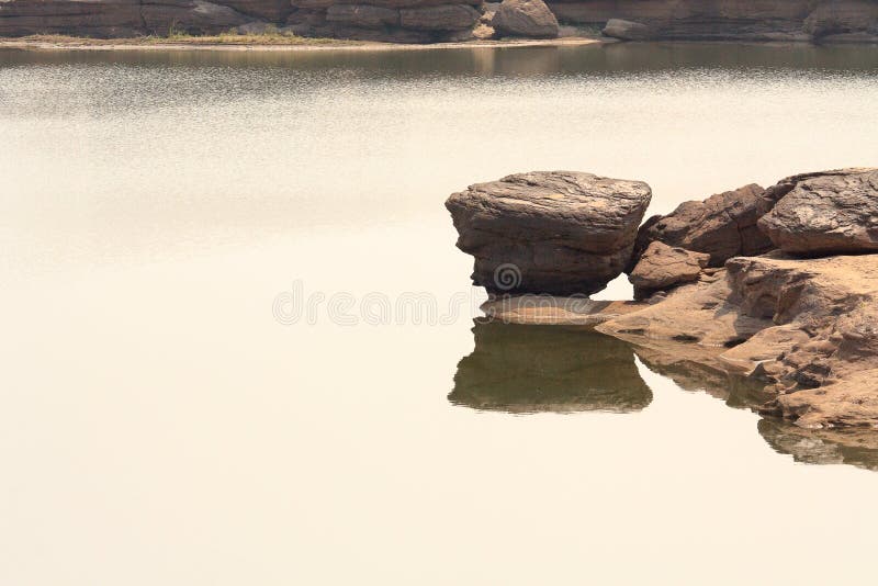 Rock over water stock photo. Image of peace, quiet, bright - 84335086