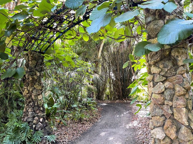A Rock Pathway through a Stone and Metal Trellis Stock Photo - Image of ...