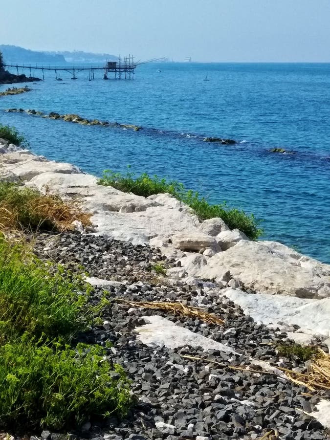 Rock and Pebbles Near the Blue Ocean Stock Photo - Image of island ...