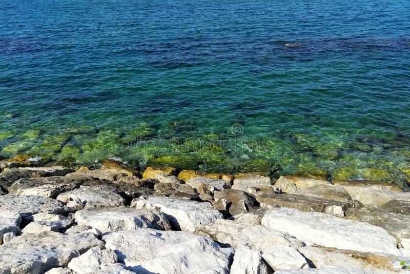 Rock and Pebbles Near the Blue Ocean Stock Image - Image of water ...
