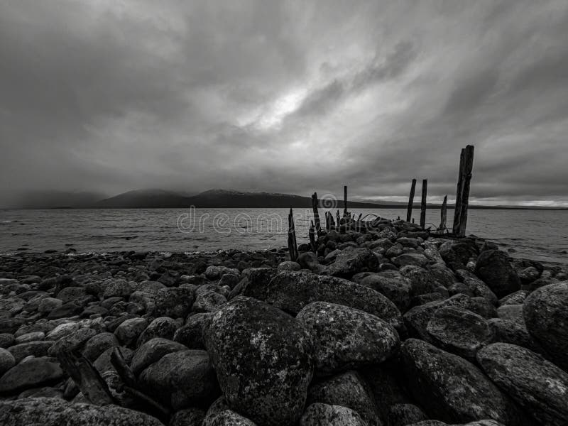 Rock pier on the lake stock photo. Image of mountain - 293859682