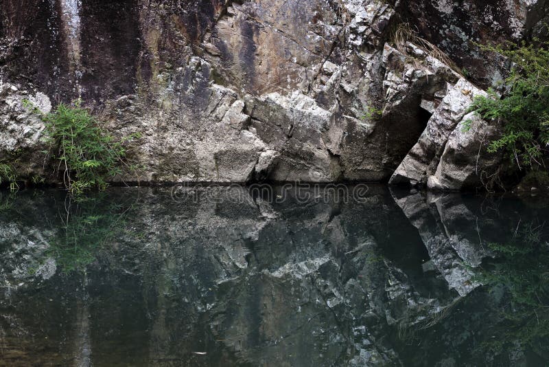 Rock and the Reflection in the Water Stock Photo - Image of rocks ...
