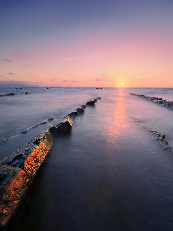 Rock Reflections at Sunset in Barrika Stock Image - Image of ...