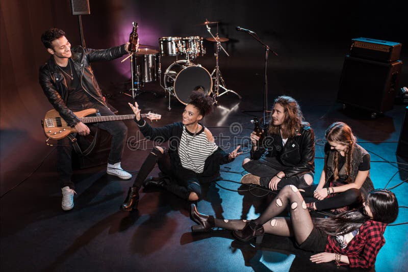 Rock and Roll Band Sitting Together and Drinking Beer after Concert on ...