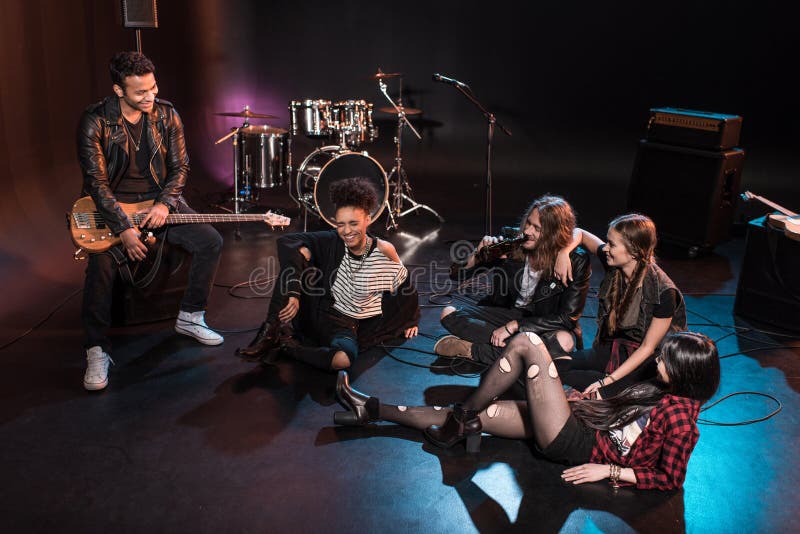 Rock and Roll Band Sitting Together and Drinking Beer after Concert on ...