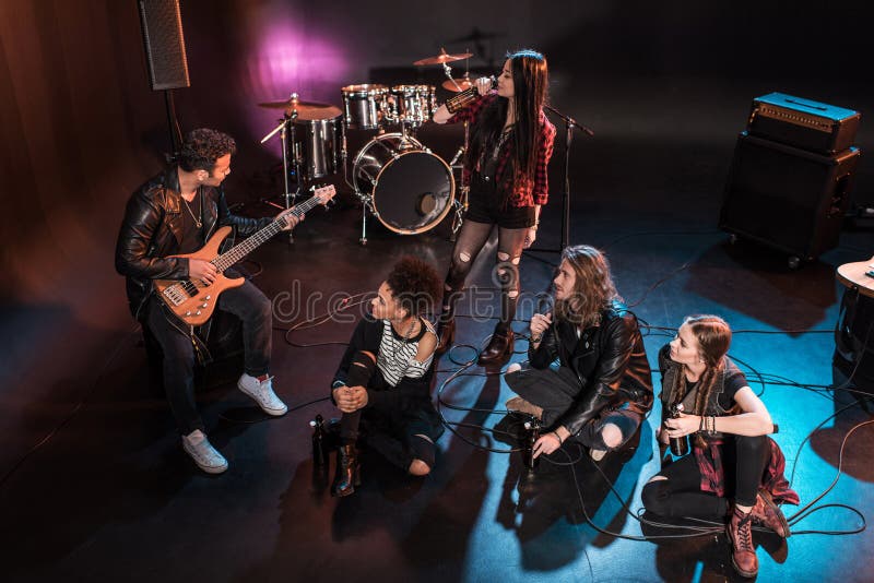 Rock and Roll Band Sitting Together and Drinking Beer after Concert on ...