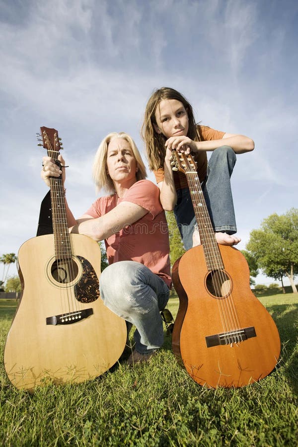 Rock and Roll Dad and Son stock image. Image of acoustic - 5404797