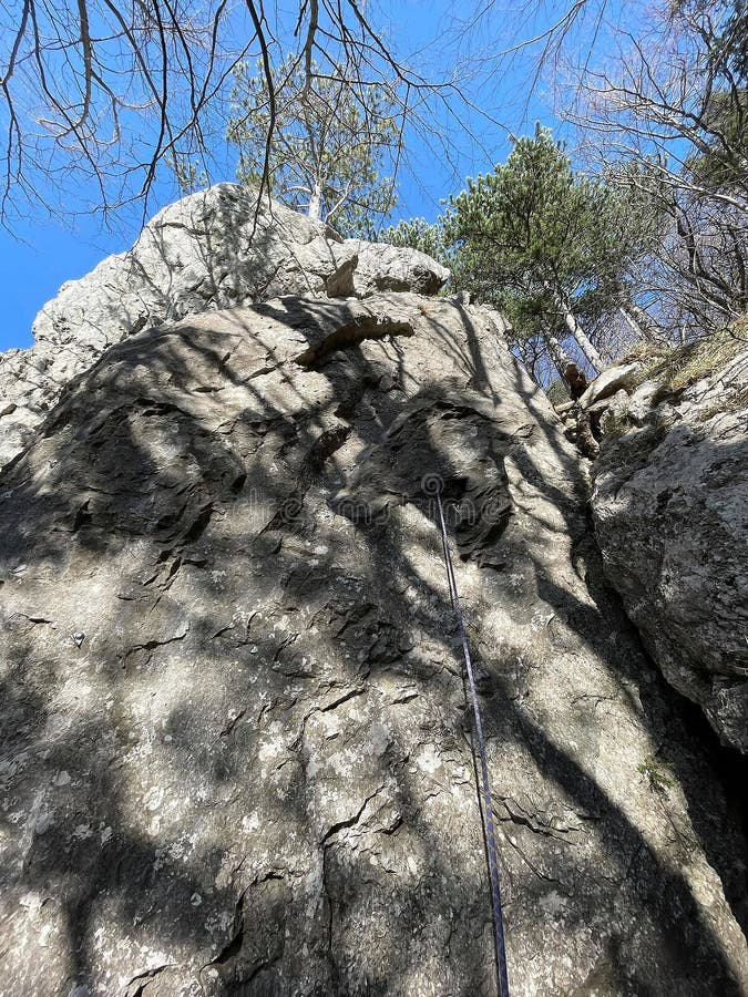 A rock with ropes to climb stock image. Image of snow - 215165341