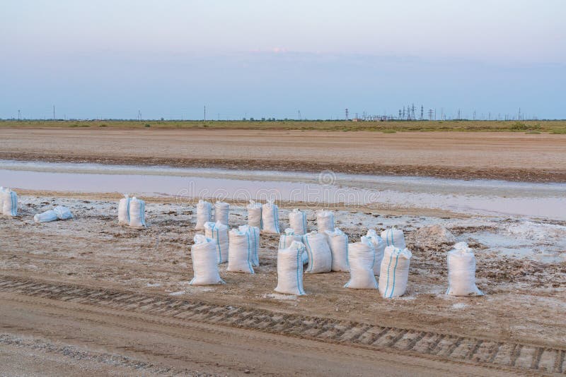 Rock salt in bags mining stock photo. Image of pile - 228734384