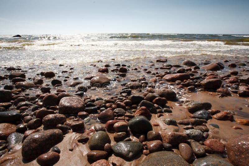 Rock and sand beach stock photo. Image of water, rives - 20794280