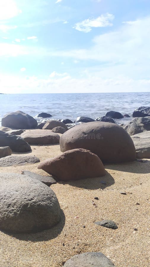 Rock Sand and Sea stock image. Image of blue, temple - 264430853