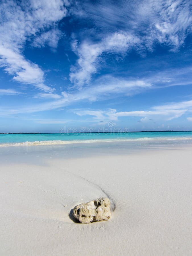 Rock on sandy beach stock photo. Image of seashore, scenery - 26907946