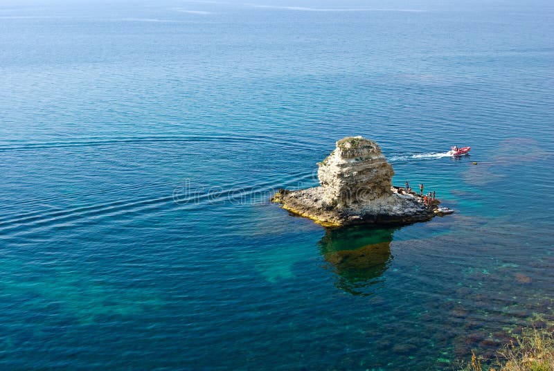 Rock in a sea stock photo. Image of scene, people, horizon - 20774110