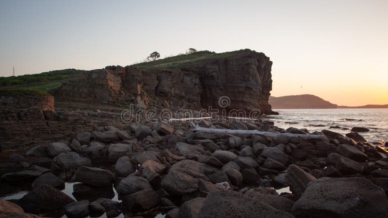Rock and Sea in Morning Sun Rays Stock Photo - Image of outdoor, water ...
