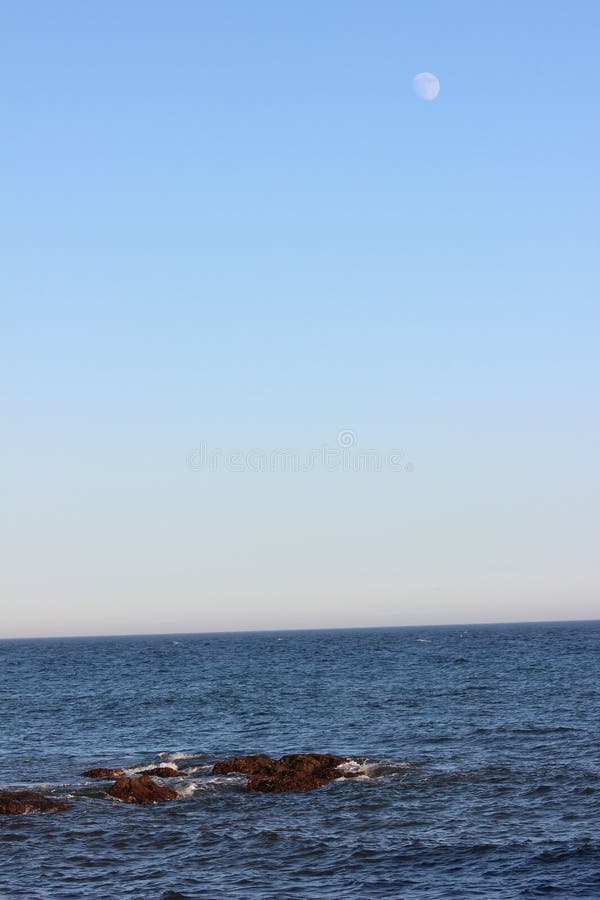 Rock in Sea and Rising Moon Stock Photo - Image of spain, moon: 50654014