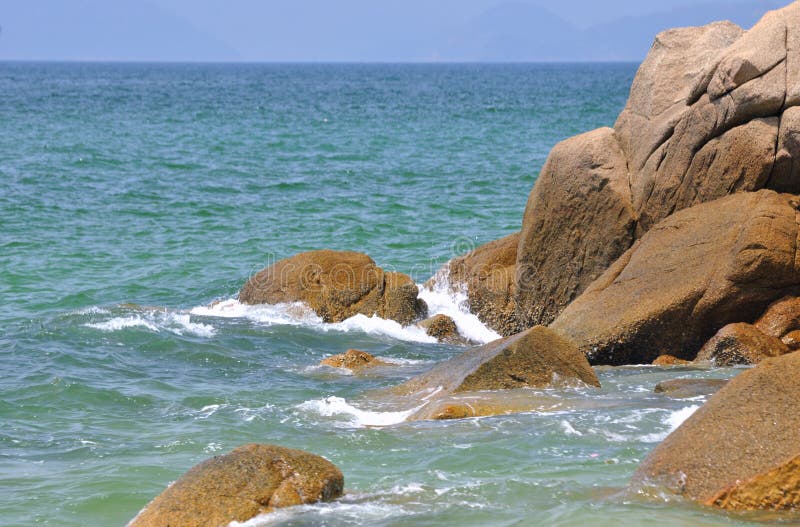 Rock at sea shore stock image. Image of shore, ochre - 19590541