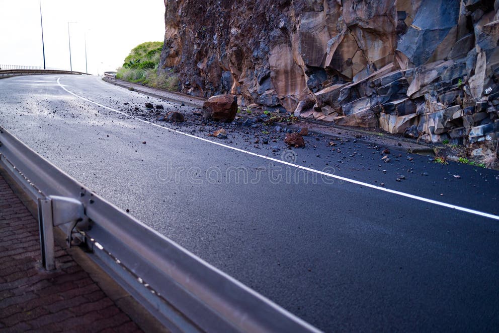 Rock slide on a road stock image. Image of danger, travel - 302105815