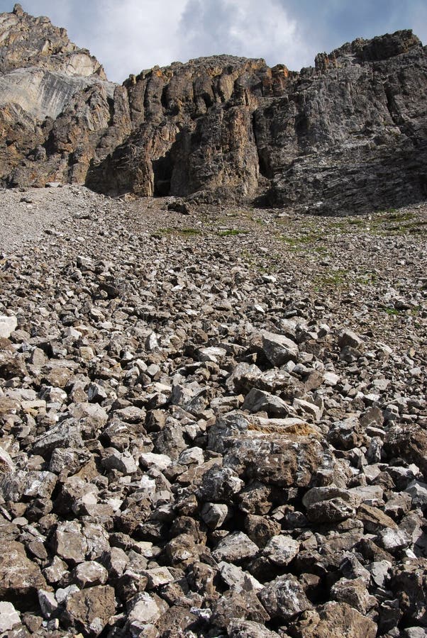 Rock slide under cliff stock photo. Image of landscape - 6059494