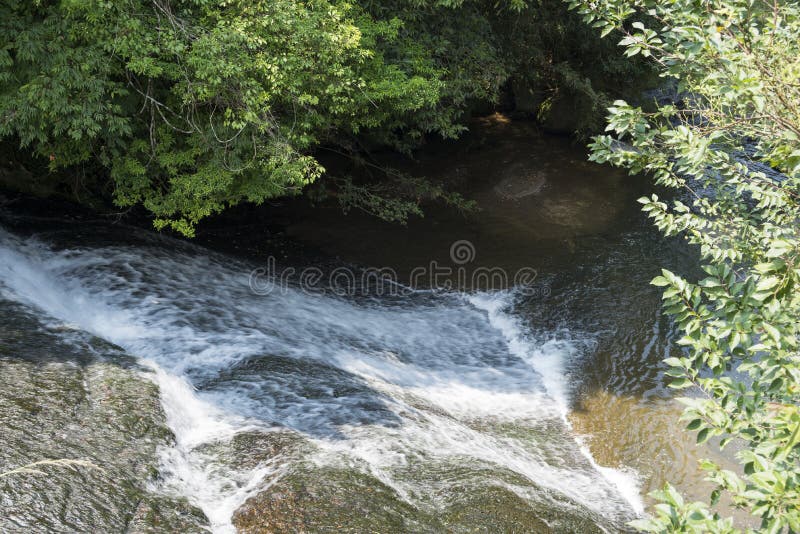 Rock slope flowing cascade stock photo. Image of color - 124526534