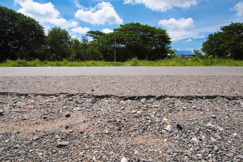 Rock and Soil Material on the Paved Road in the Rural Areas. Stock ...
