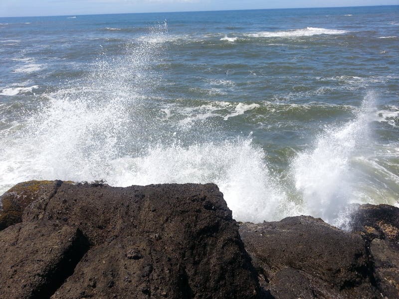Rock splash stock photo. Image of waves, beach, blue - 47364390