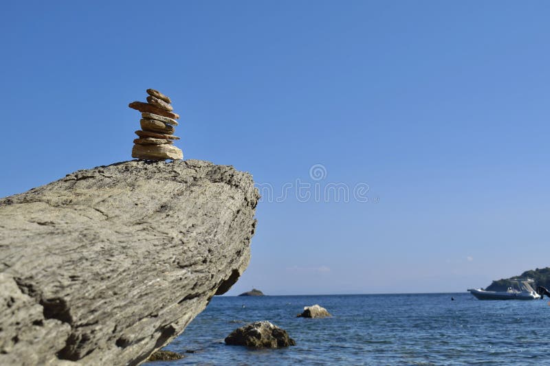 Rock Stack beside the Ocean on a Calm, Sunny Day in Greece Stock Photo ...